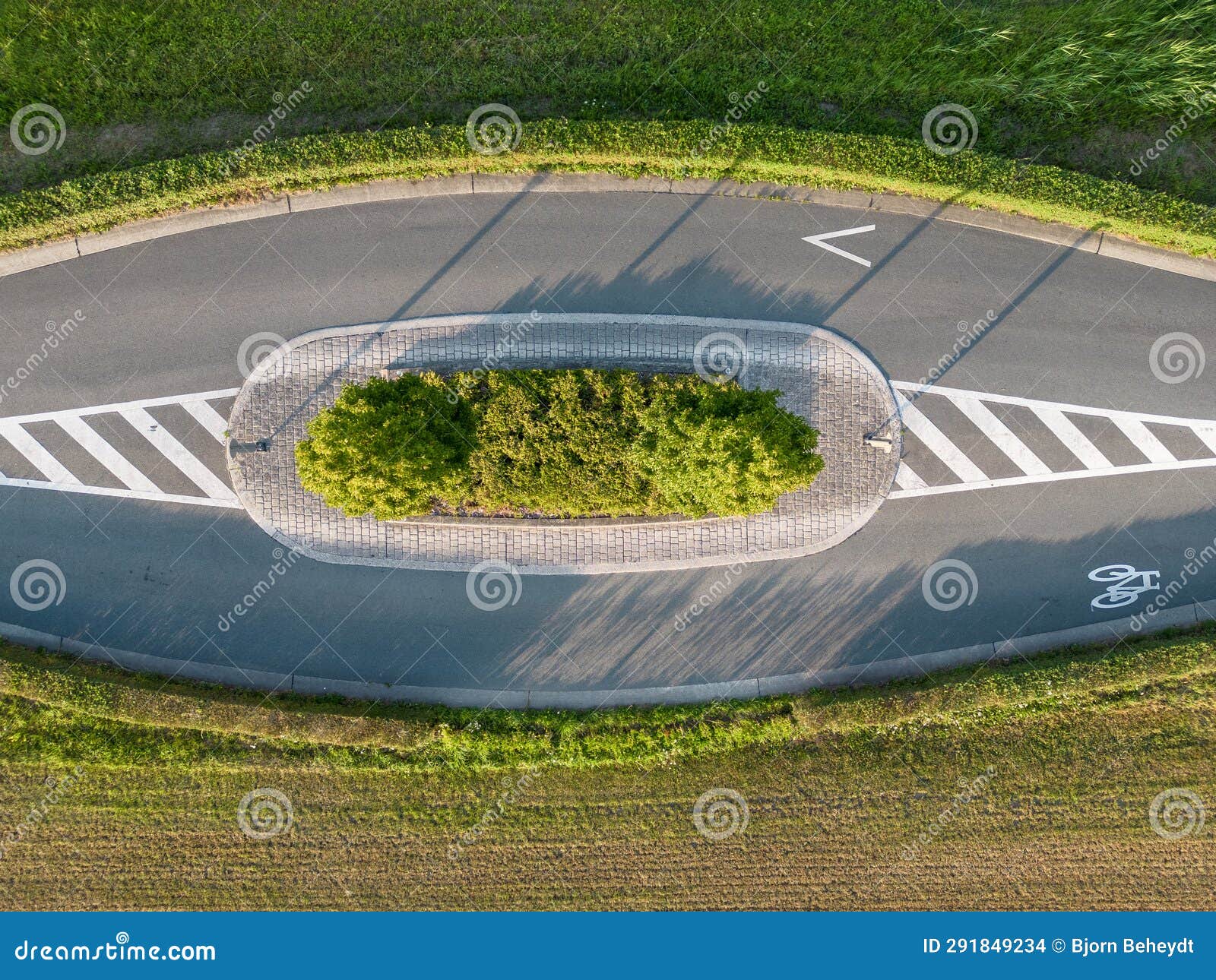 Unusual Split: Countryside Road Curiously Divided Amidst Fields Stock ...