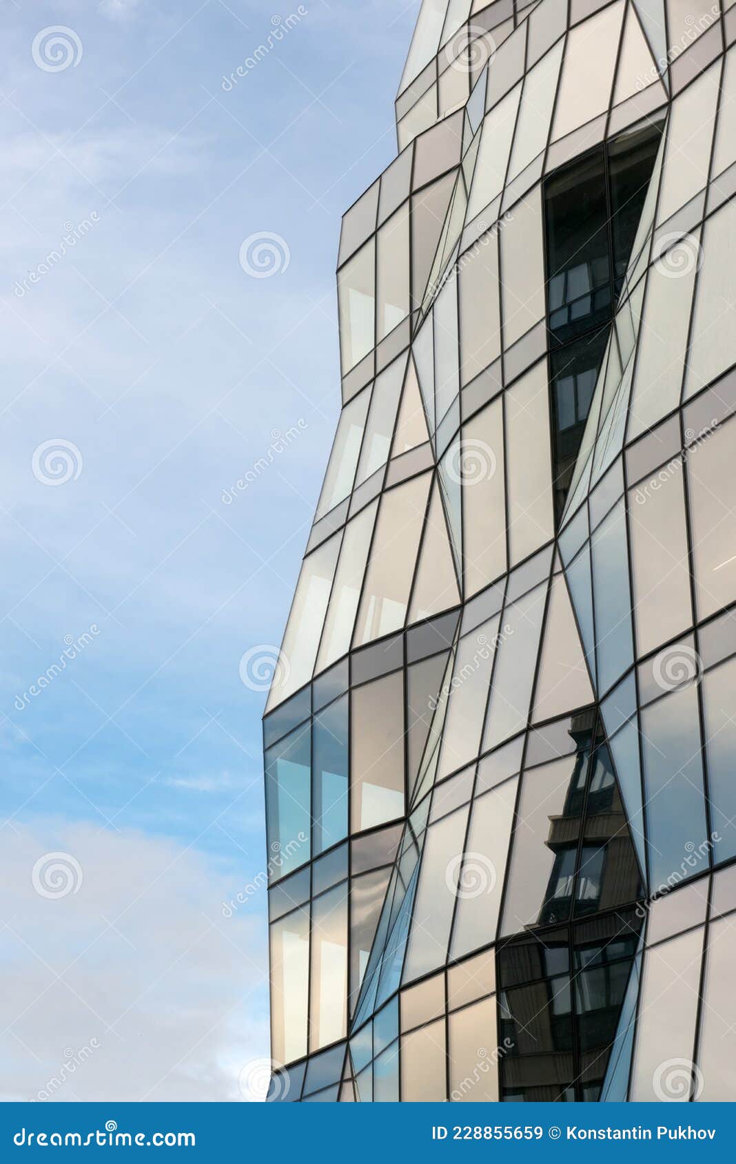 Unusually Shaped Glass Walls of a Modern Building Stock Image - Image ...
