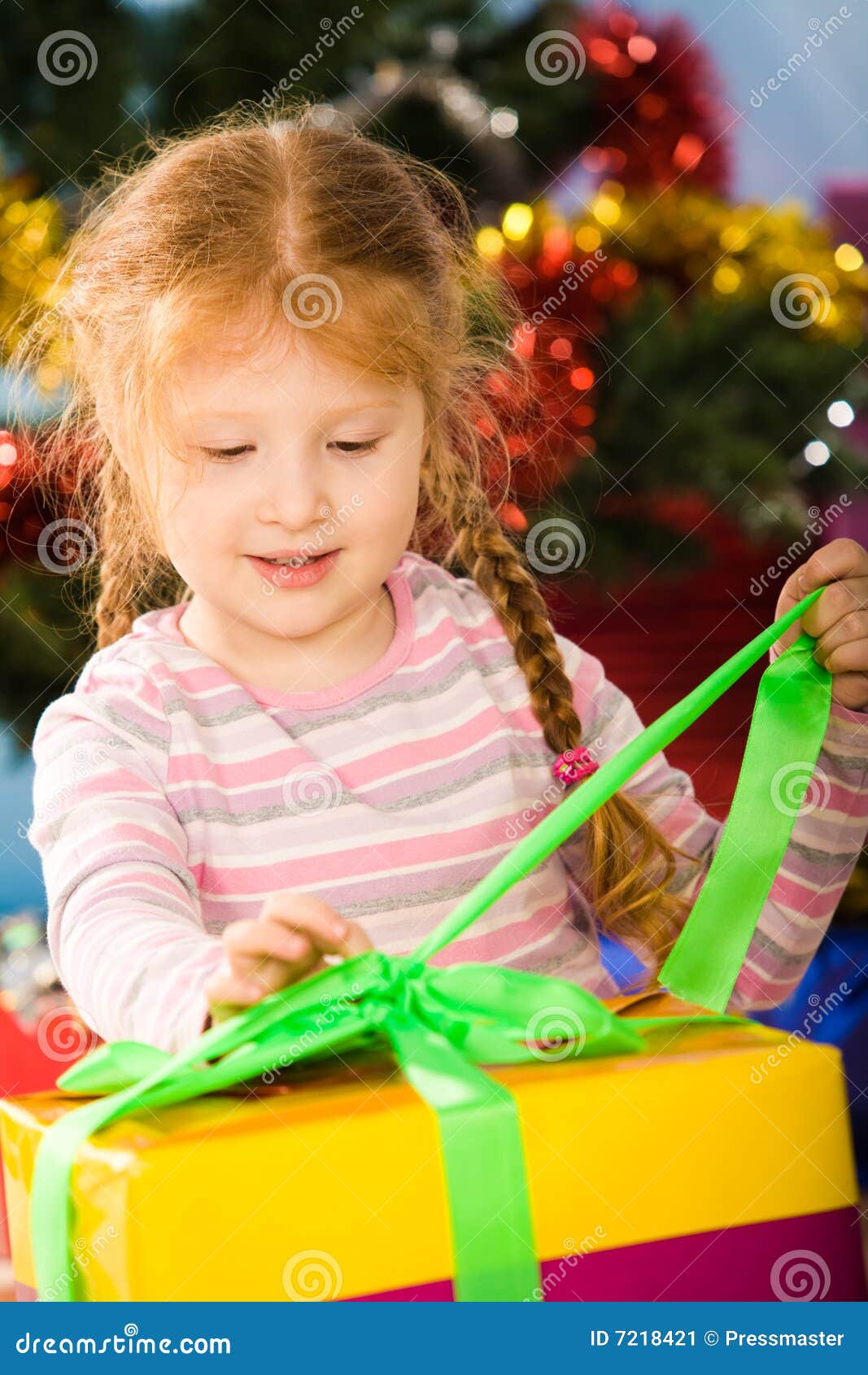 Unwrapping present stock image. Image of positive, festive - 7218421