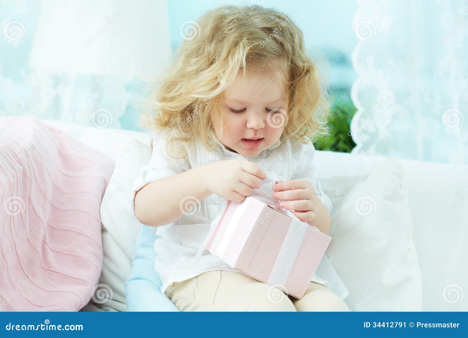 Unwrapping present stock image. Image of event, interested - 34412791