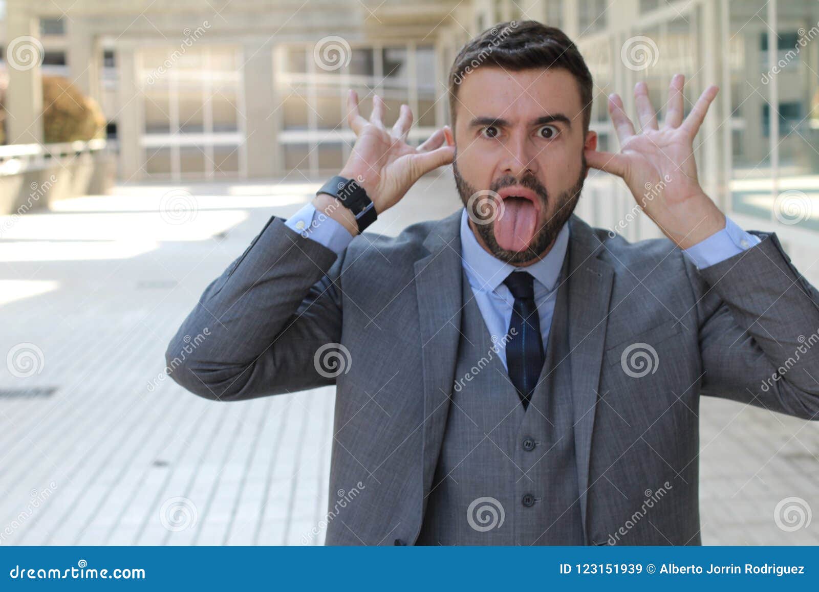 Uomo D'affari Irriverente Che Attacca Lingua Fuori Immagine Stock ... Uomo D'affari Irriverente Che Attacca Lingua Fuori Immagine Stock ...