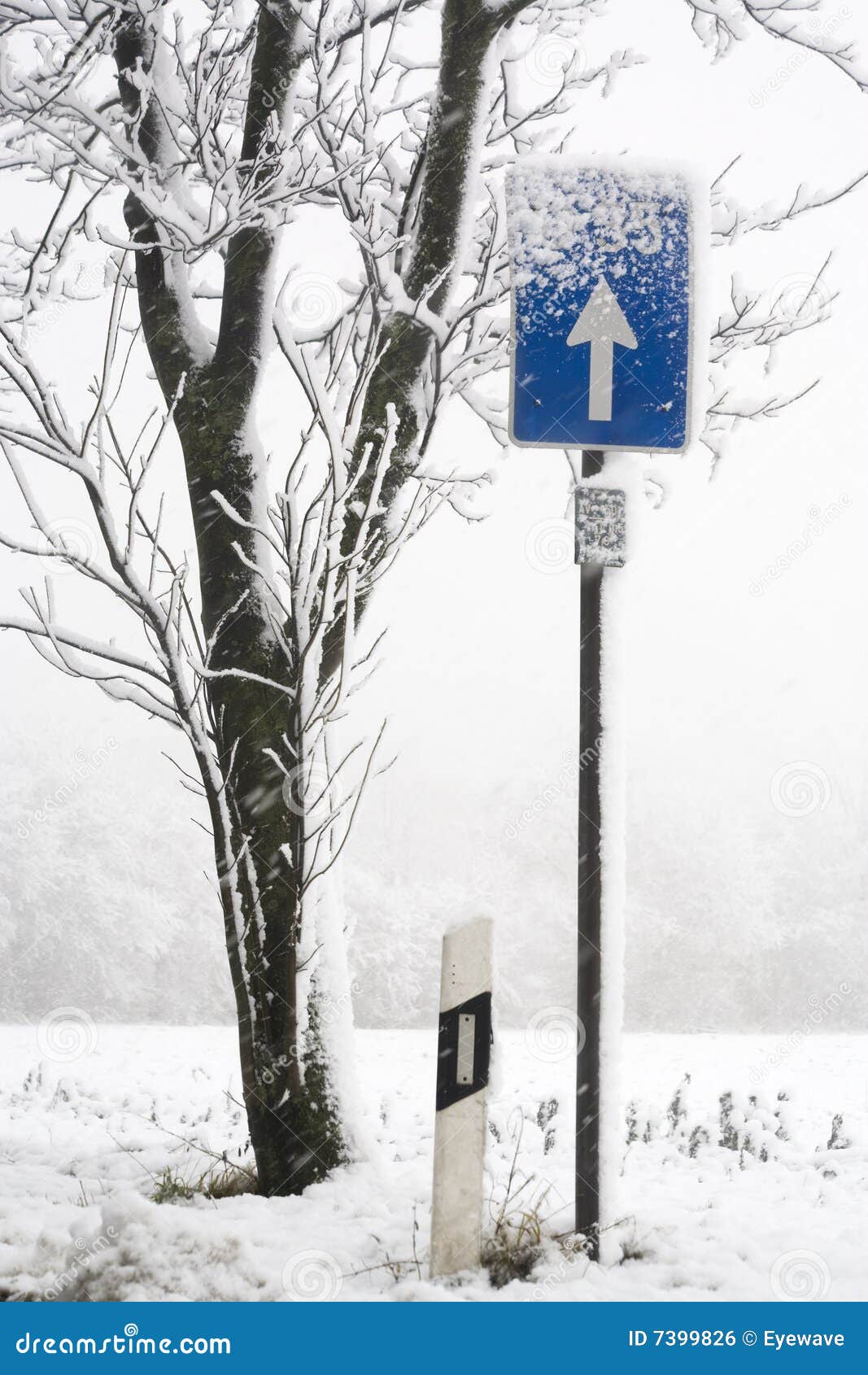 Up arrow sign in snowfall stock photo. Image of wind, snow - 7399826