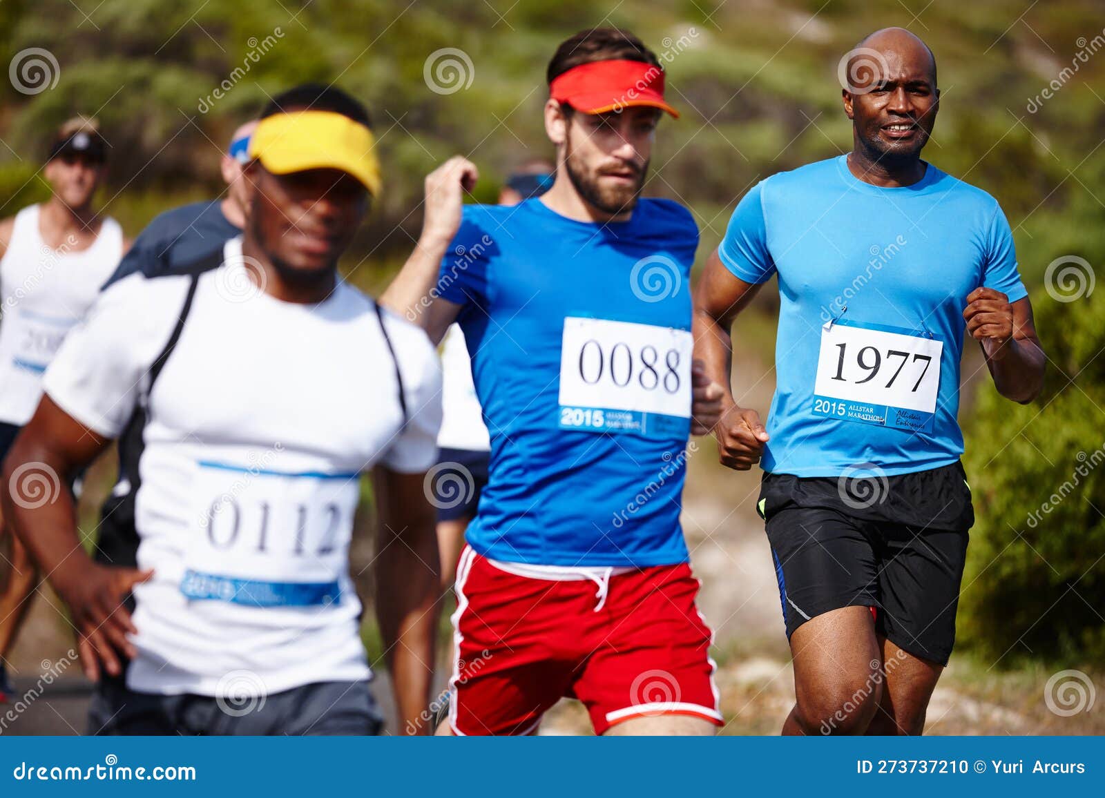 Always Up for a Challenge. a Group of Young Men Running a Marathon ...
