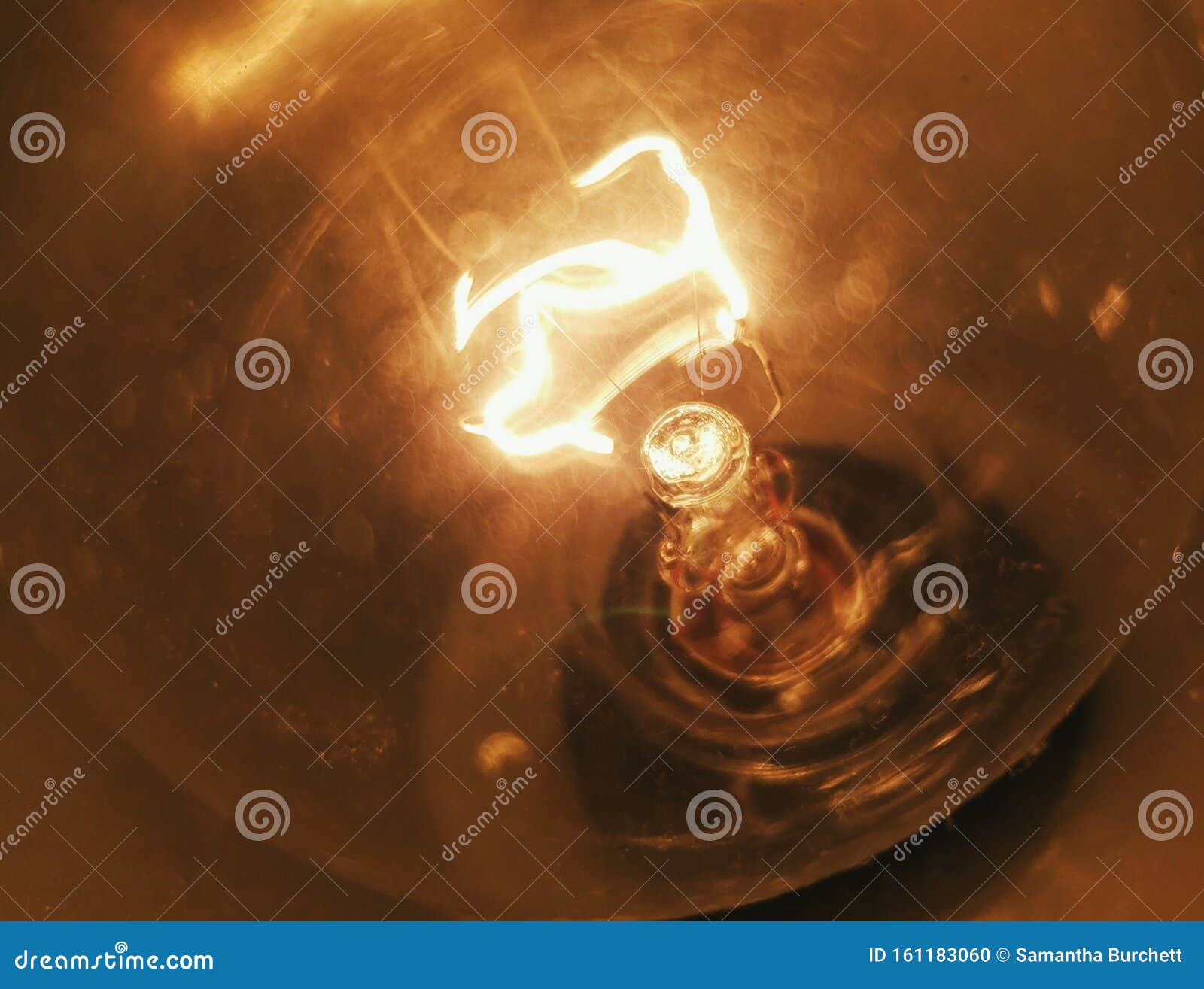 Up Close of a Light Bulb and the Wires Lit Up with Heat Making Light ...