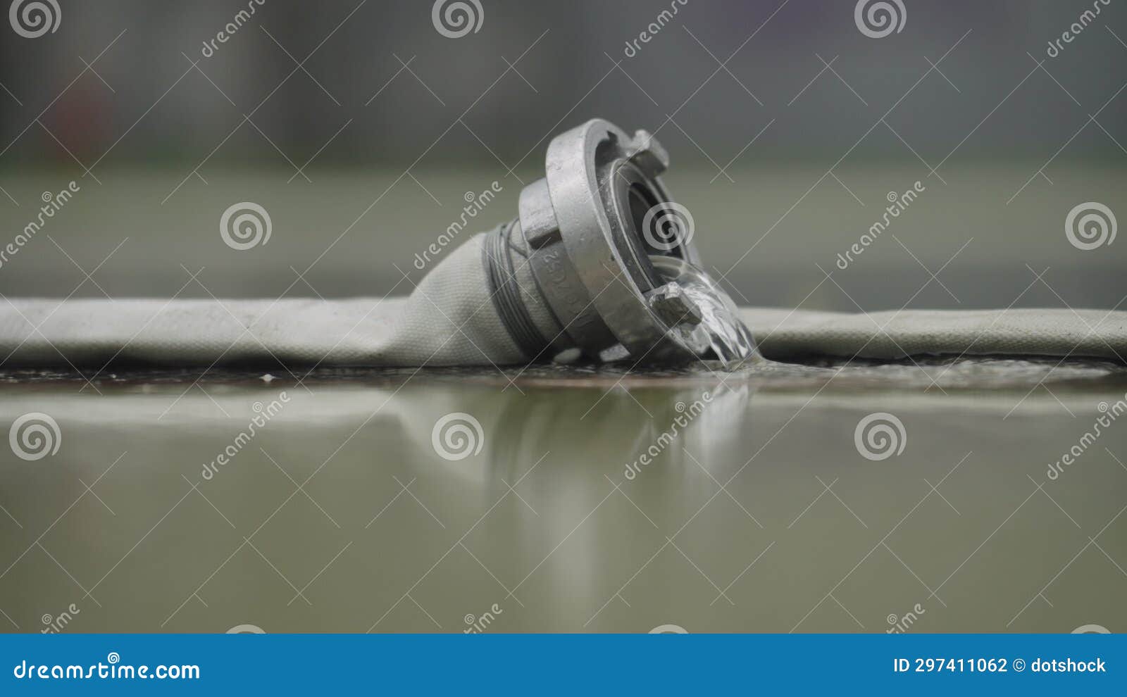 An Up-close Shot Captures a Fire Hose with a Powerful Stream of Water ...