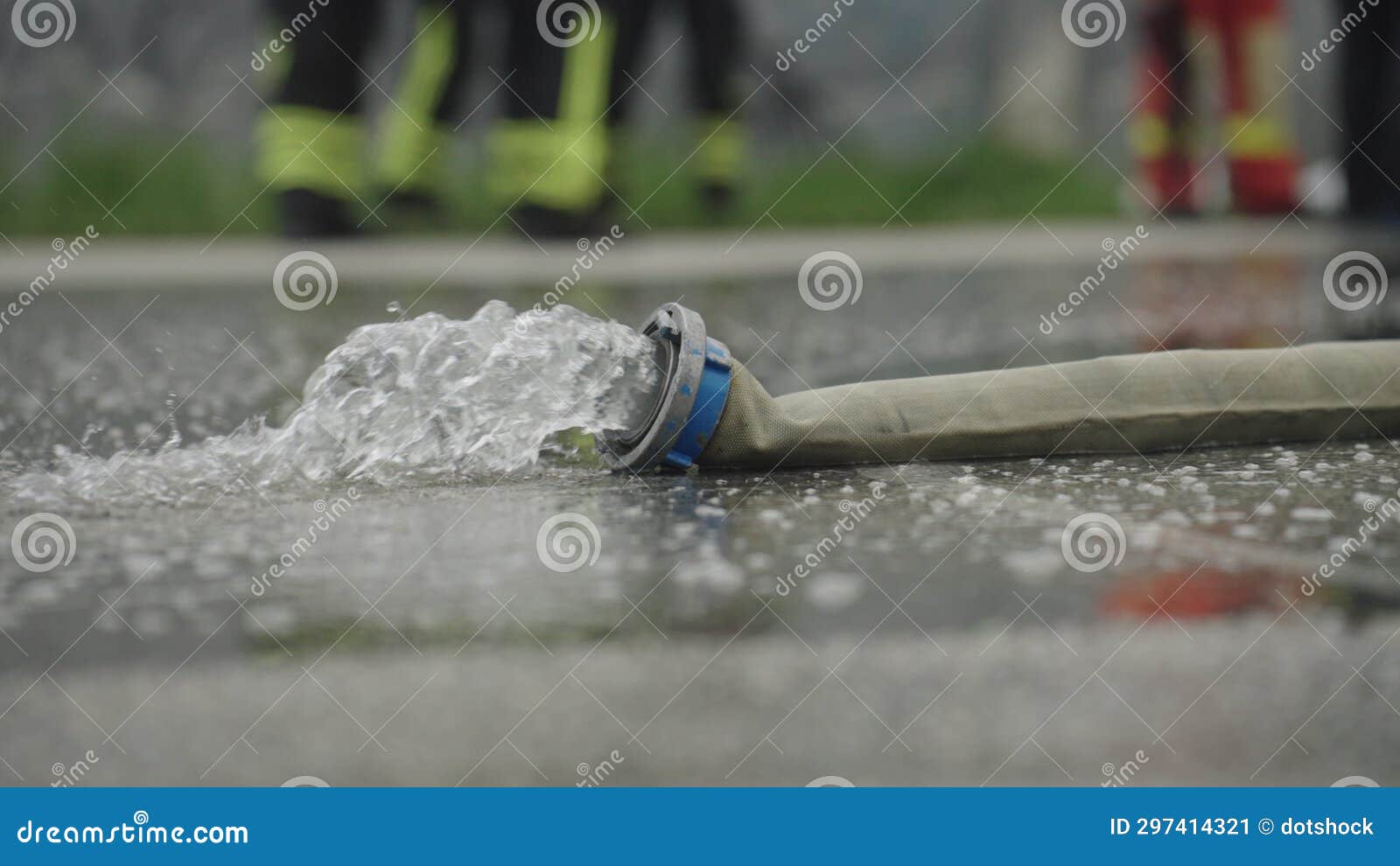 An Up-close Shot Captures a Fire Hose with a Powerful Stream of Water ...