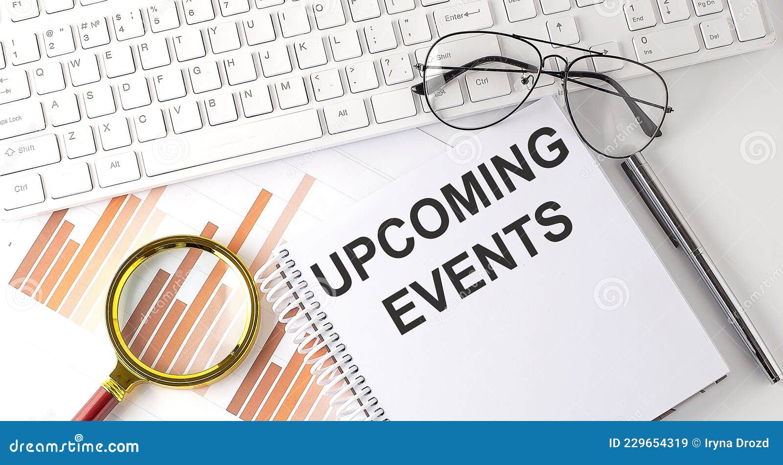 UPCOMING EVENTS Text Written on a Notebook with Keyboard, Chart,and ...