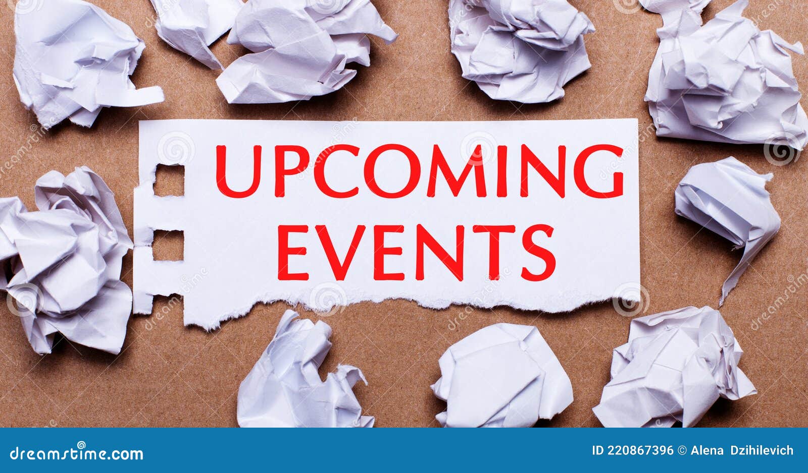 UPCOMING EVENTS Written on White Paper on a Light Brown Background ...