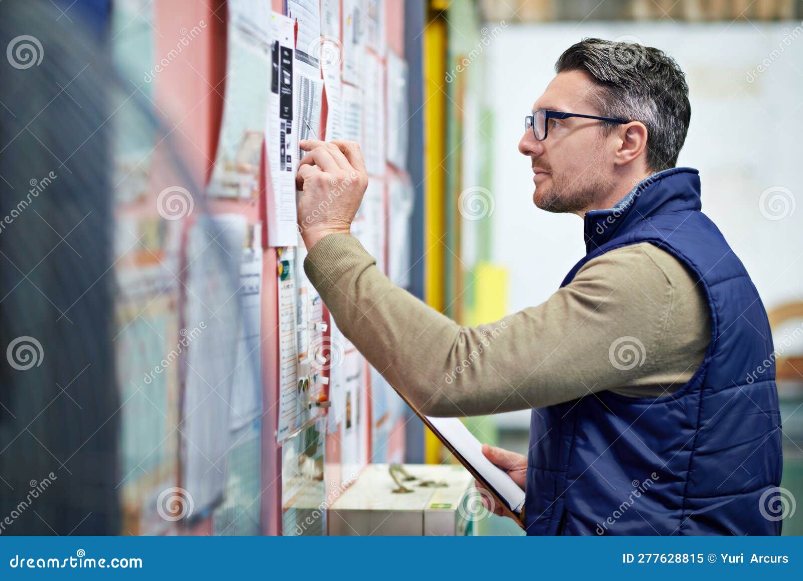 Updating Schedules. a Man Working in a Large Warehouse. Stock Image ...