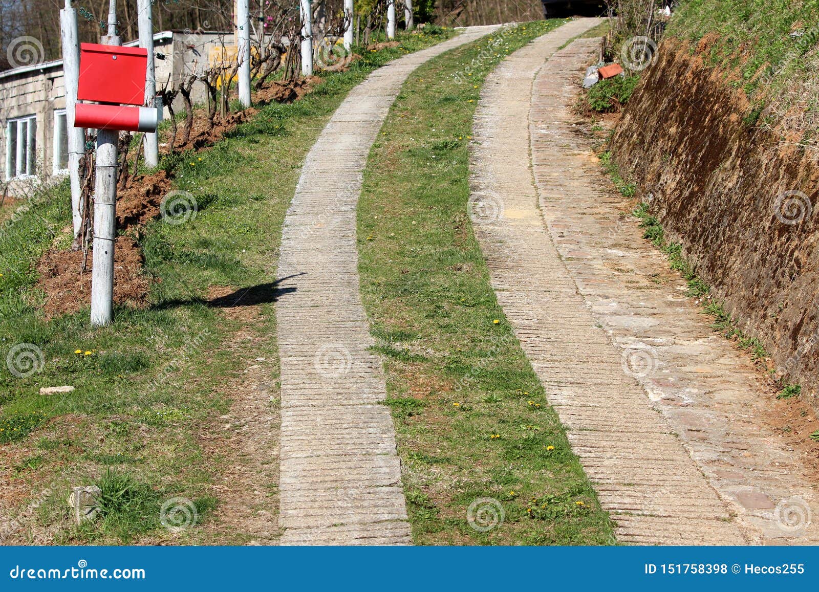 Uphill Path in Rural Area Made of Stone Tiles and Grass Surrounded with ...