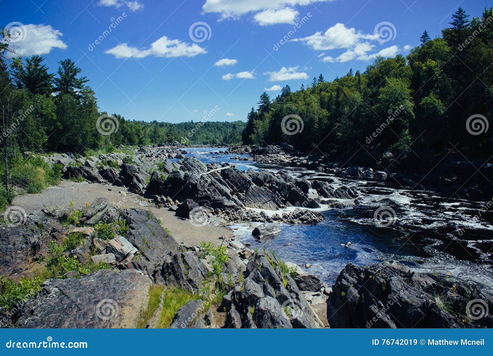 Uplifted Rocks in River stock image. Image of clouds - 76742019