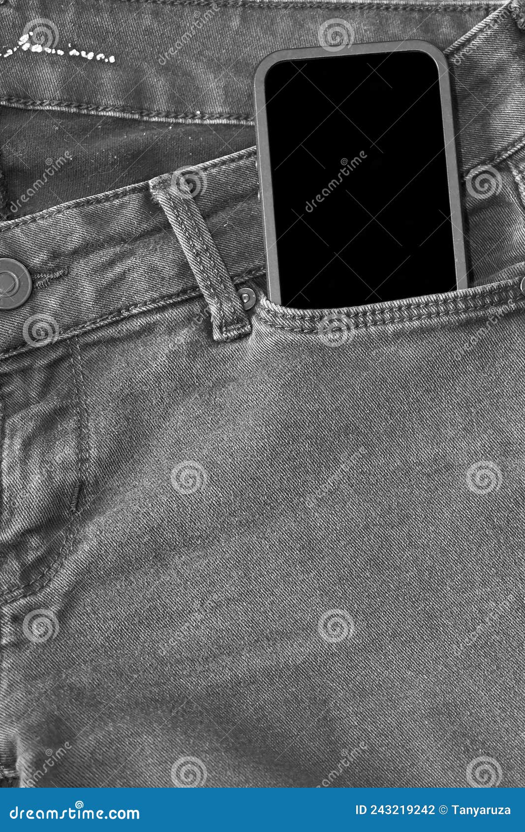 The Upper Part of Old Worn Black Jeans and a Smartphone with a Black ...