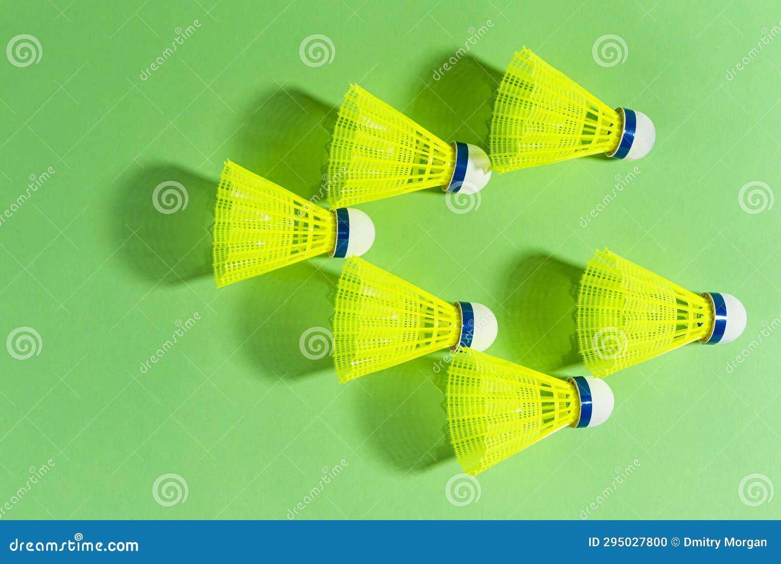Upper View of Line of New Shuttlecocks on Green Background As Flatlay ...