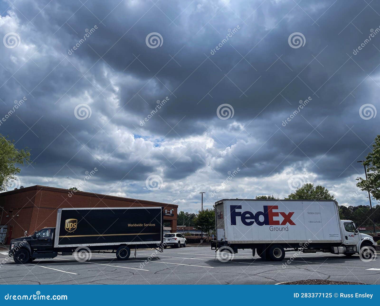 UPS and FedEx Trucks Parked Opposite Each Other Editorial Image - Image ... UPS and FedEx Trucks Parked Opposite Each Other Editorial Image - Image ...