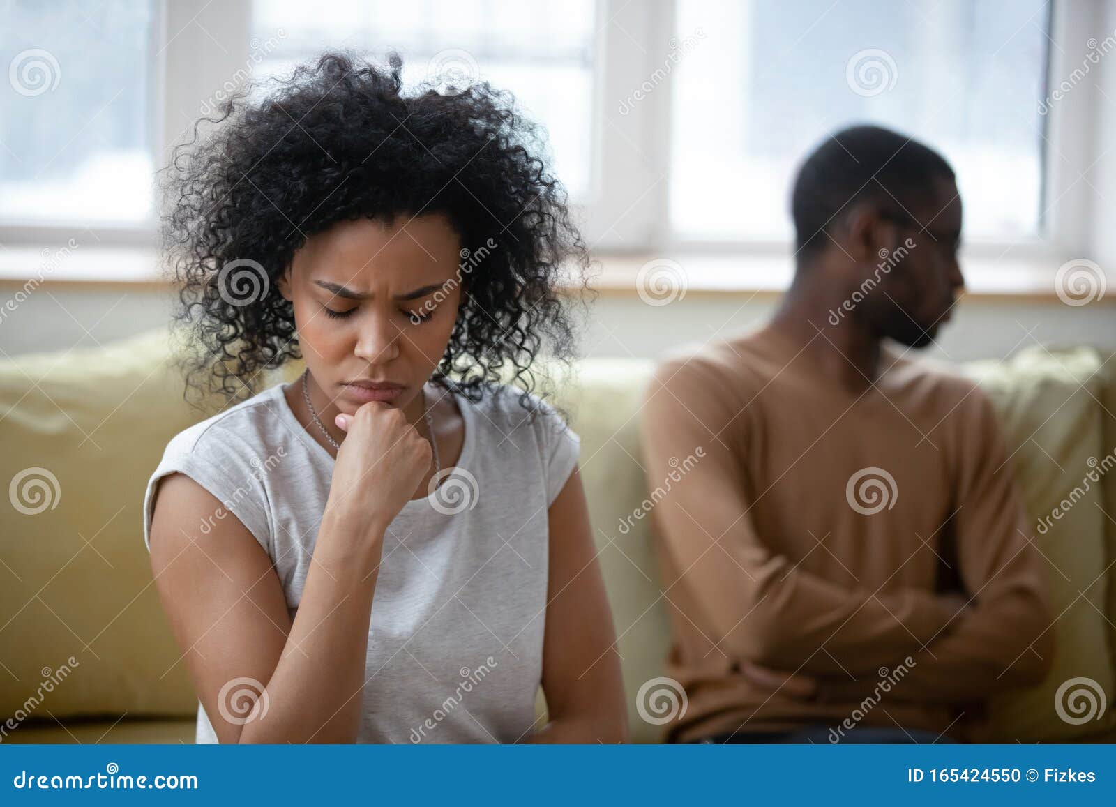 Upset Biracial Woman Think Of Breakup After Fight With Husband Stock