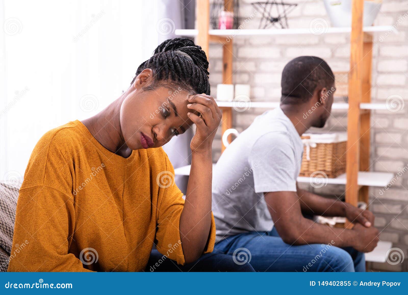 Upset African Couple Sitting on Sofa Stock Image - Image of african ...
