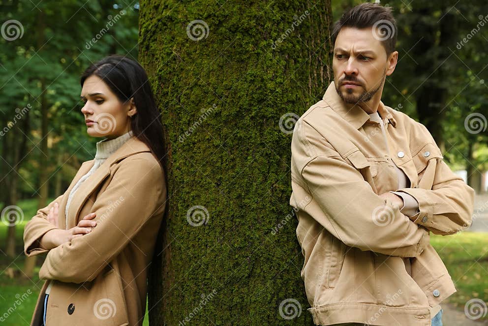 Upset Arguing Couple Near Tree in Park. Relationship Problems Stock ...