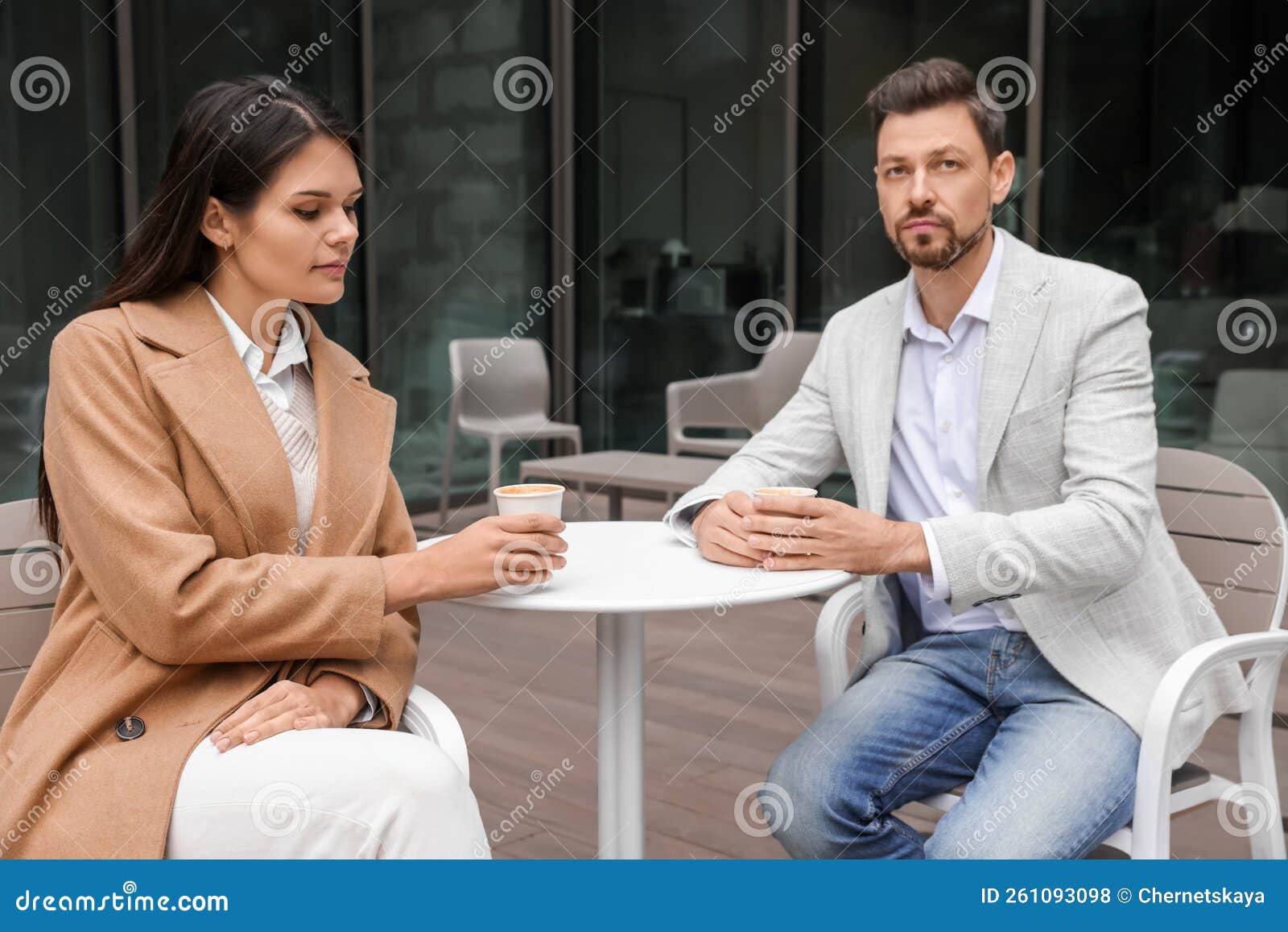 Upset Arguing Couple in Outdoor Cafe. Relationship Problems Stock Photo ...