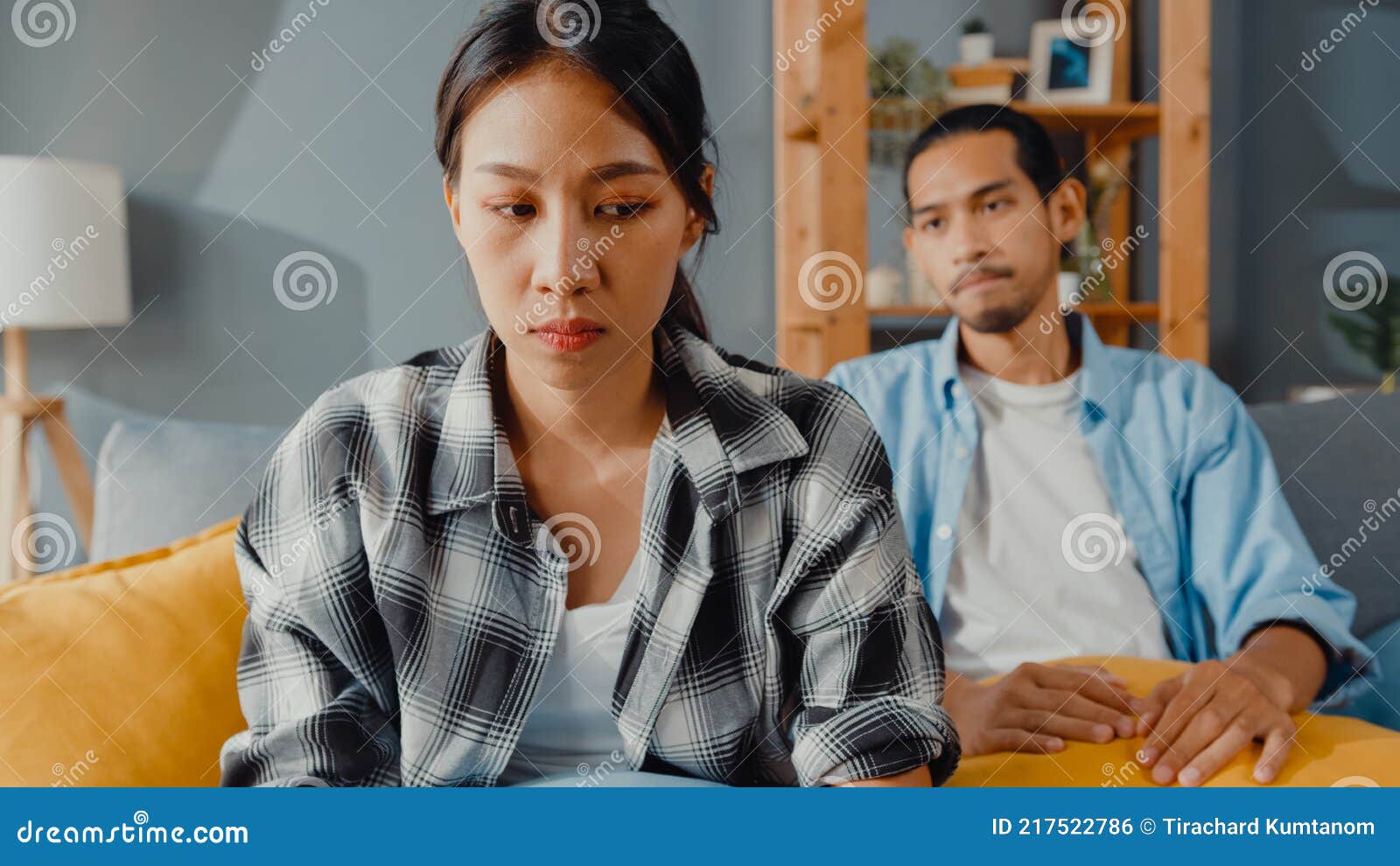 Upset Asian Couple Wife Sit On Couch Listen To Furious Husband Yelling ... Upset Asian Couple Wife Sit On Couch Listen To Furious Husband Yelling ...