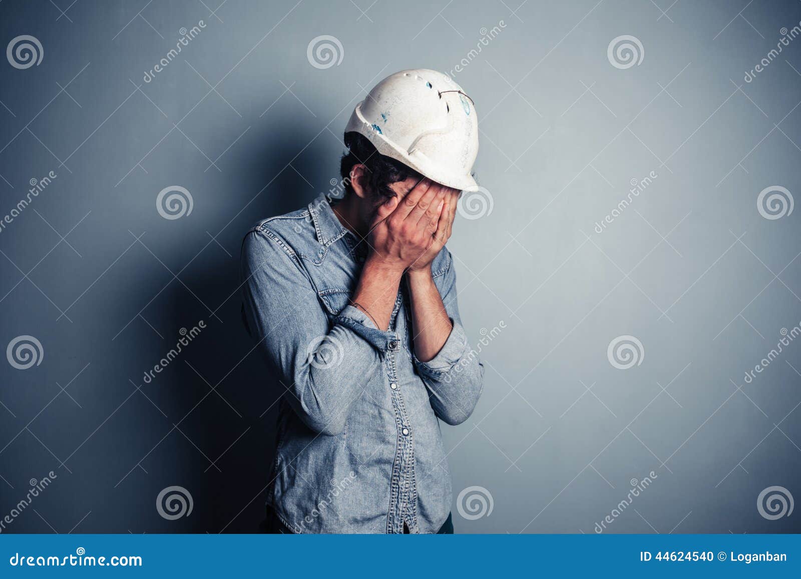 Upset blue collar worker stock photo. Image of male, hardhat - 44624540