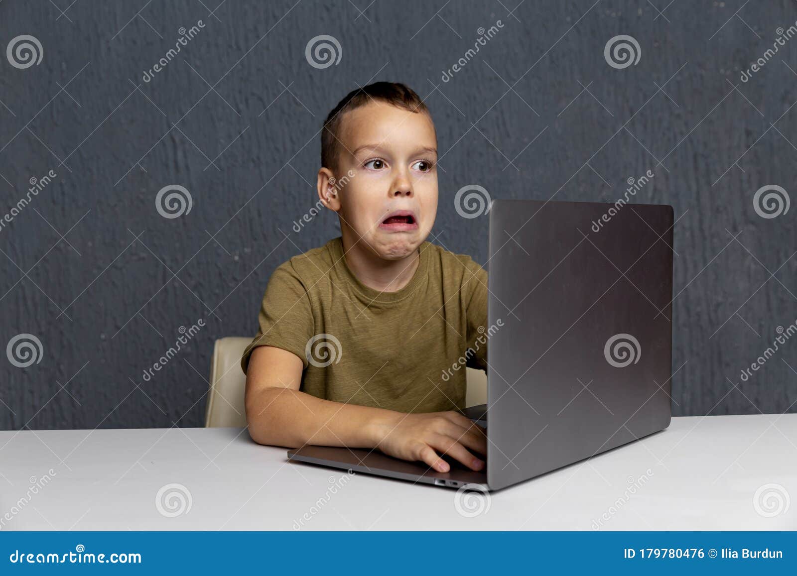 Upset Boy Sitting and Studying on the Computer Online at Quarantine ...