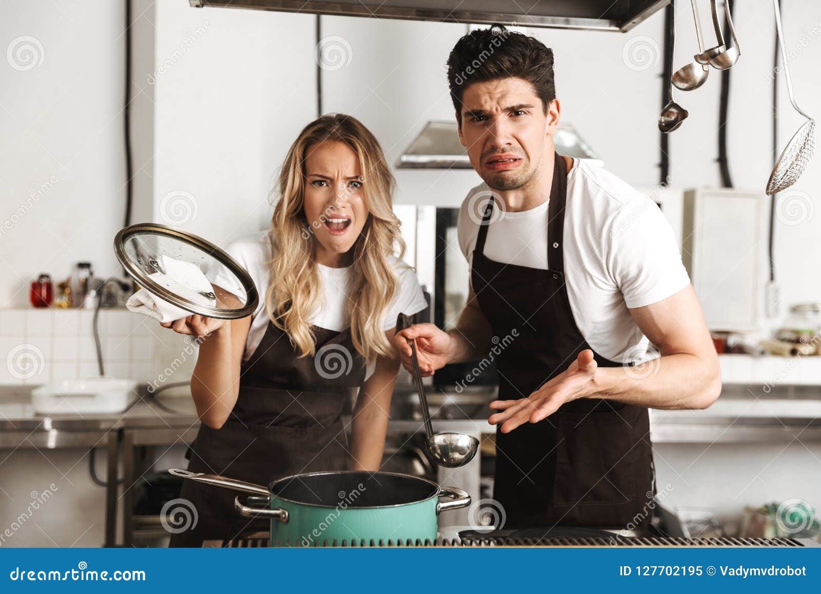 Upset Chefs Couple Dressed in Aprons Cooking Stock Image - Image of ...