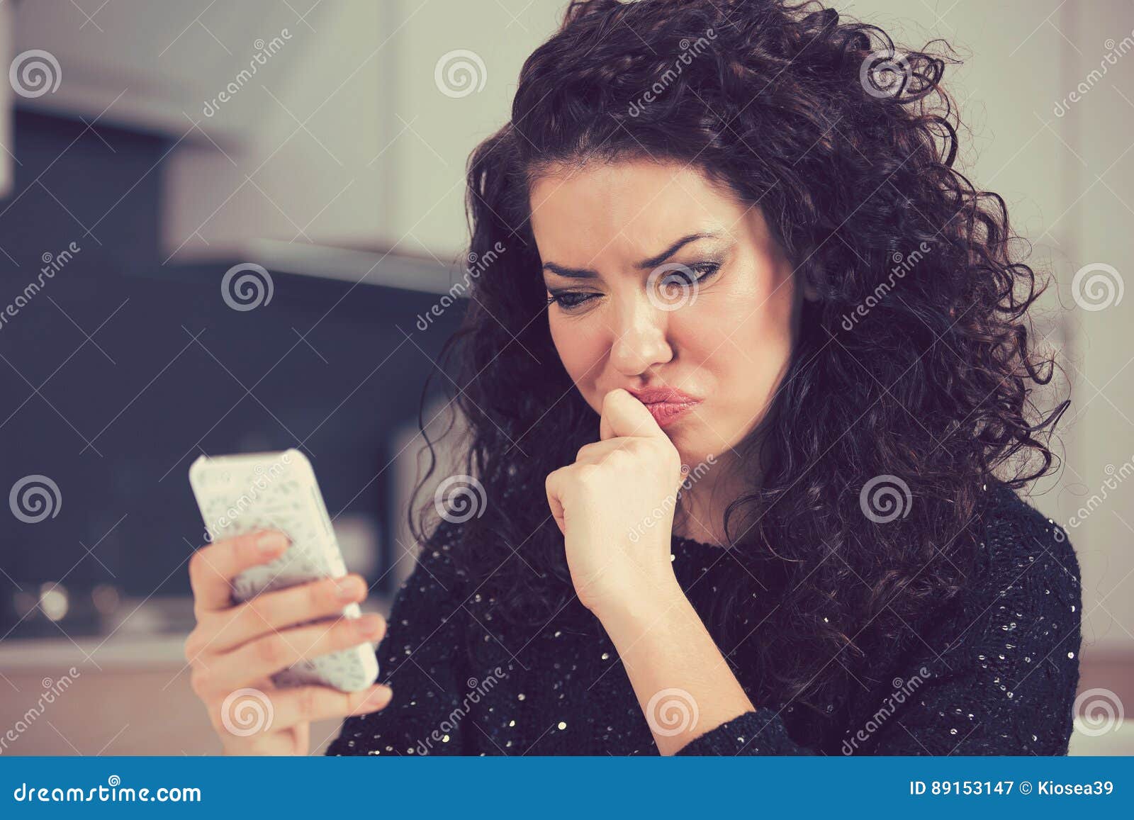 Upset Confused Young Woman Looking At Mobile Phone Reading Text Message