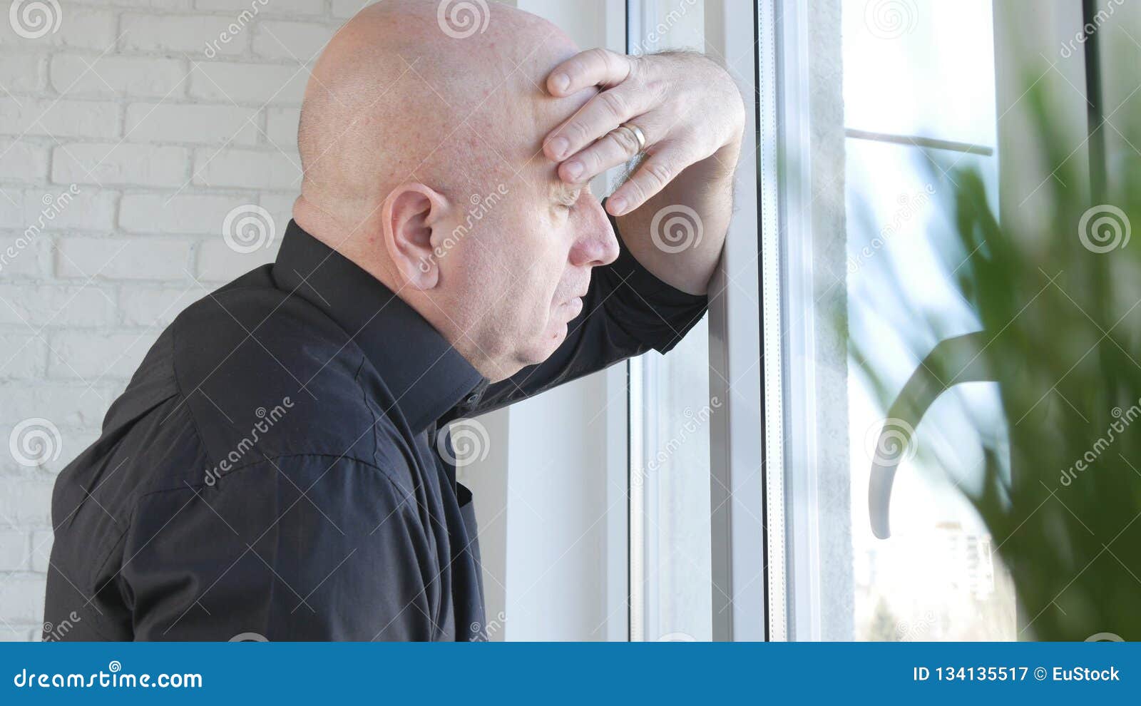 Upset and Disappointed Businessman Looking Worried on the Window Stock ...