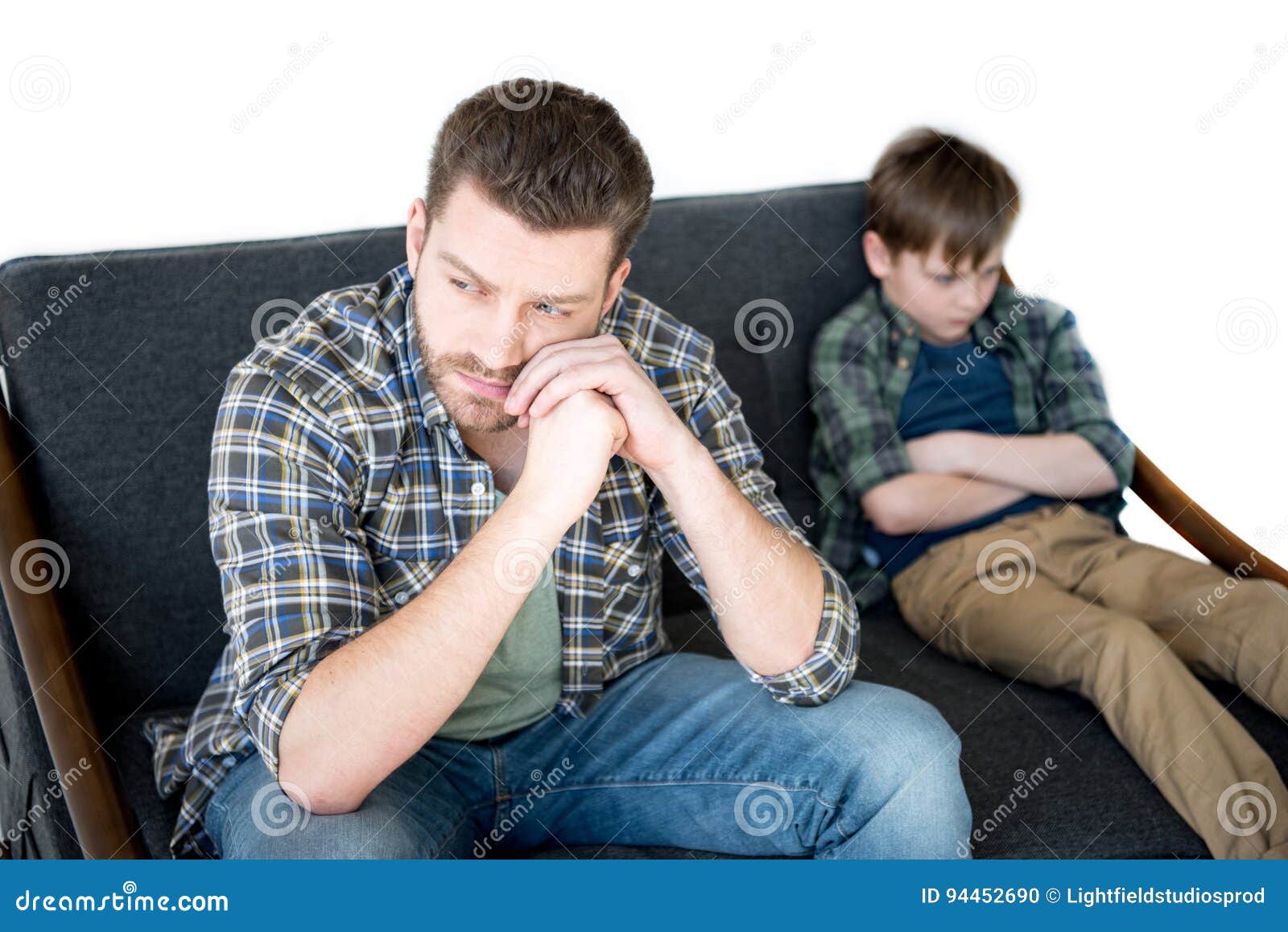 Upset Father and Son Sitting on Sofa after Quarrel Stock Photo - Image ...