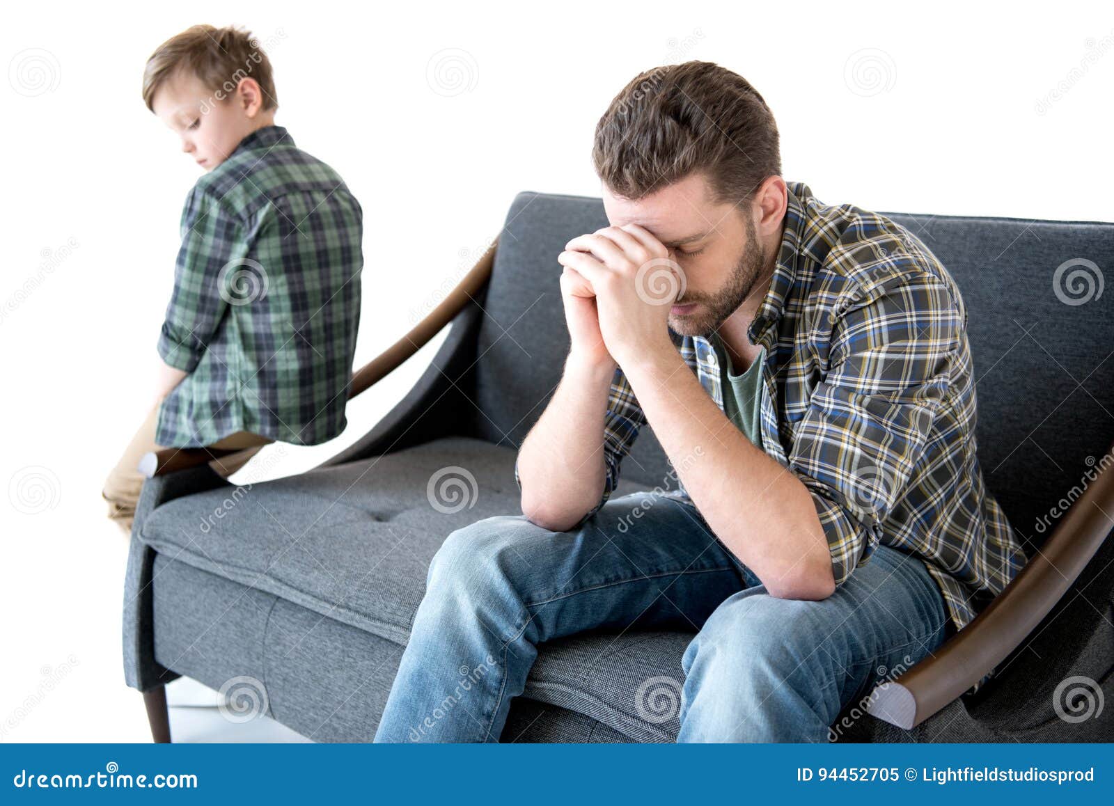 Upset Father and Son Sitting on Sofa after Quarrel Stock Image - Image ...