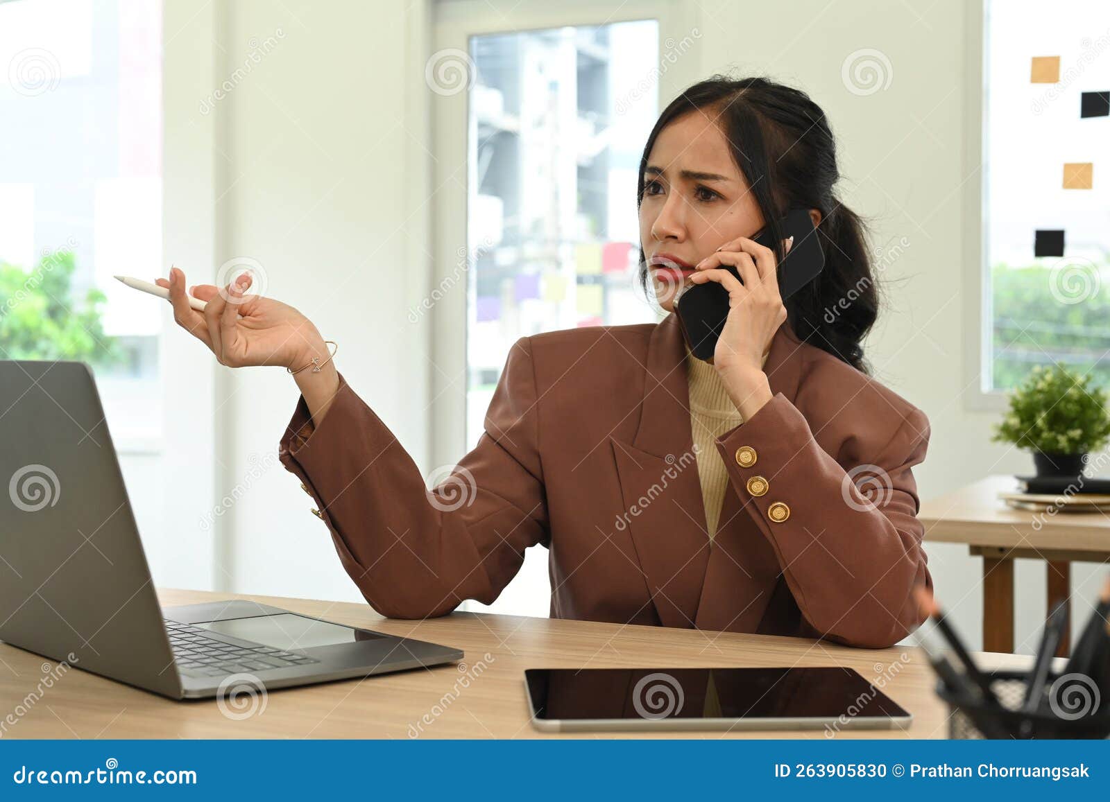 Upset Female Business Advisor Having Phone Conversation with Client and ...