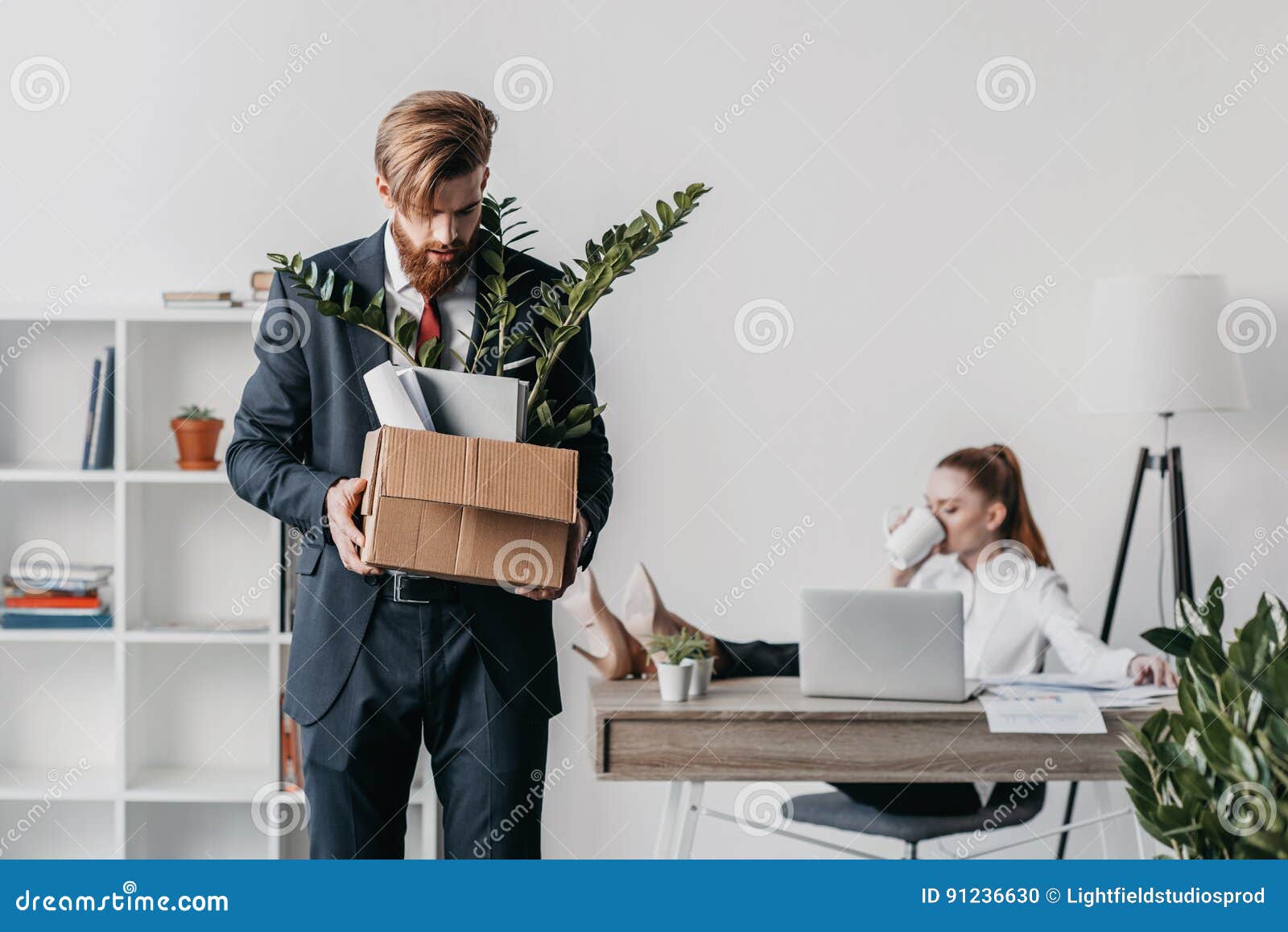Upset Fired Businessman with Cardboard Box in Office, Boss Behind Stock ...