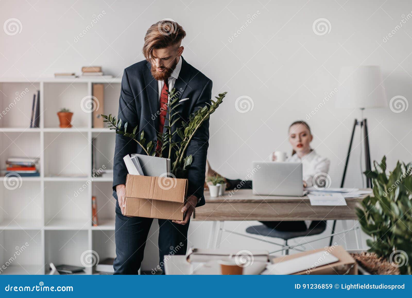 Upset Fired Dismissed Young Woman Employee Packing Box Leaving W ...