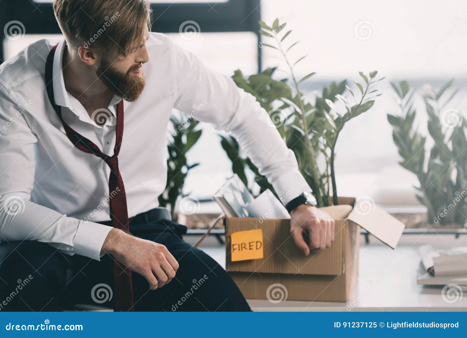 Upset Fired Businessman with Cardboard Box in Office Stock Image ...