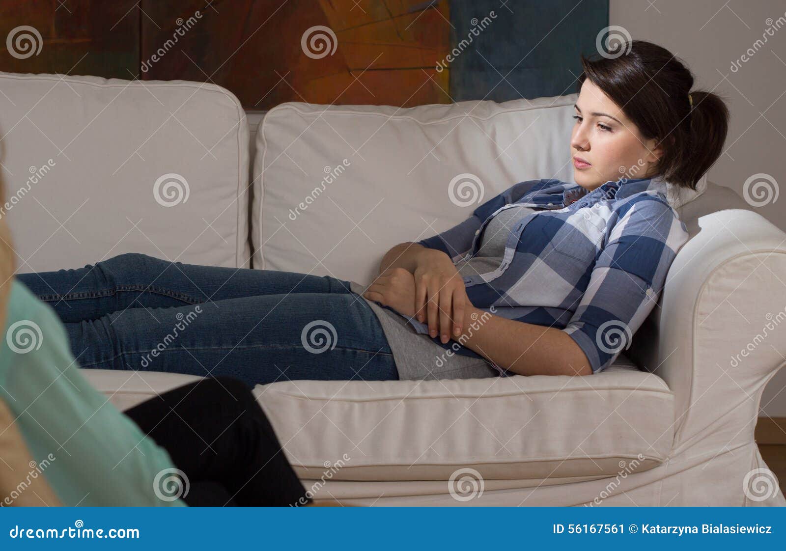Upset girl lying on sofa stock image. Image of girl, confide - 56167561