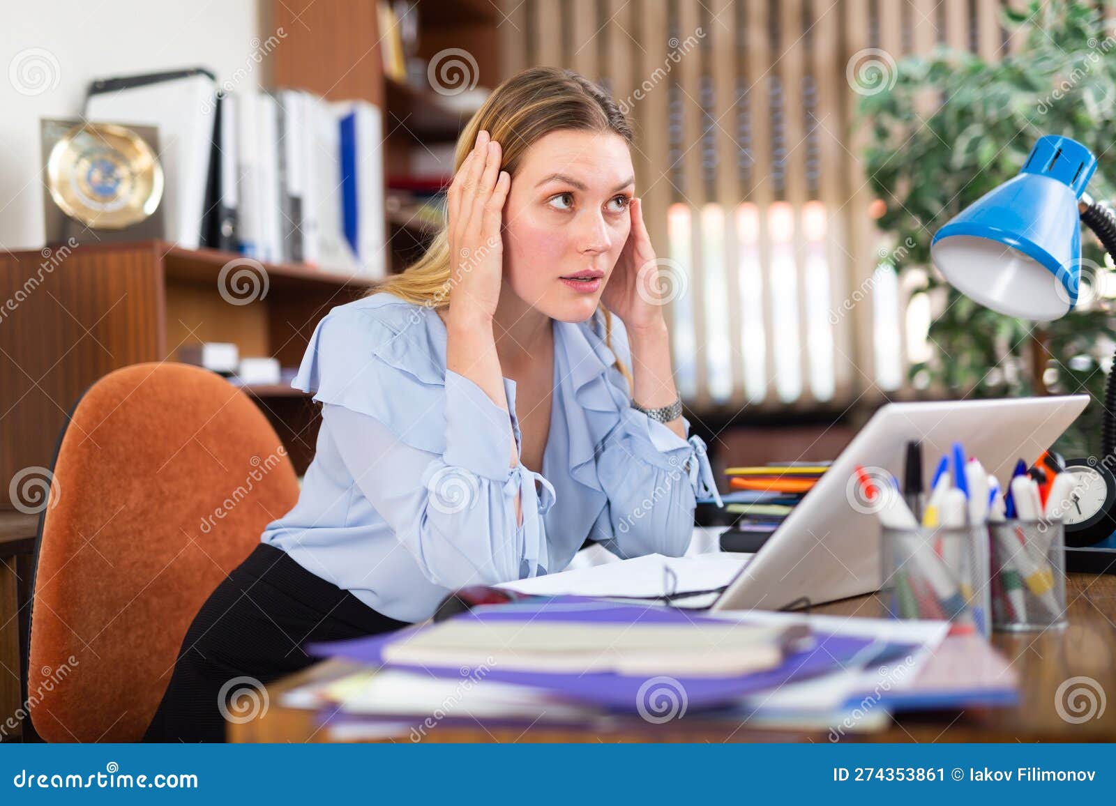 Upset Girl Secretary in the Office Sitting at the Workplace at Computer ...