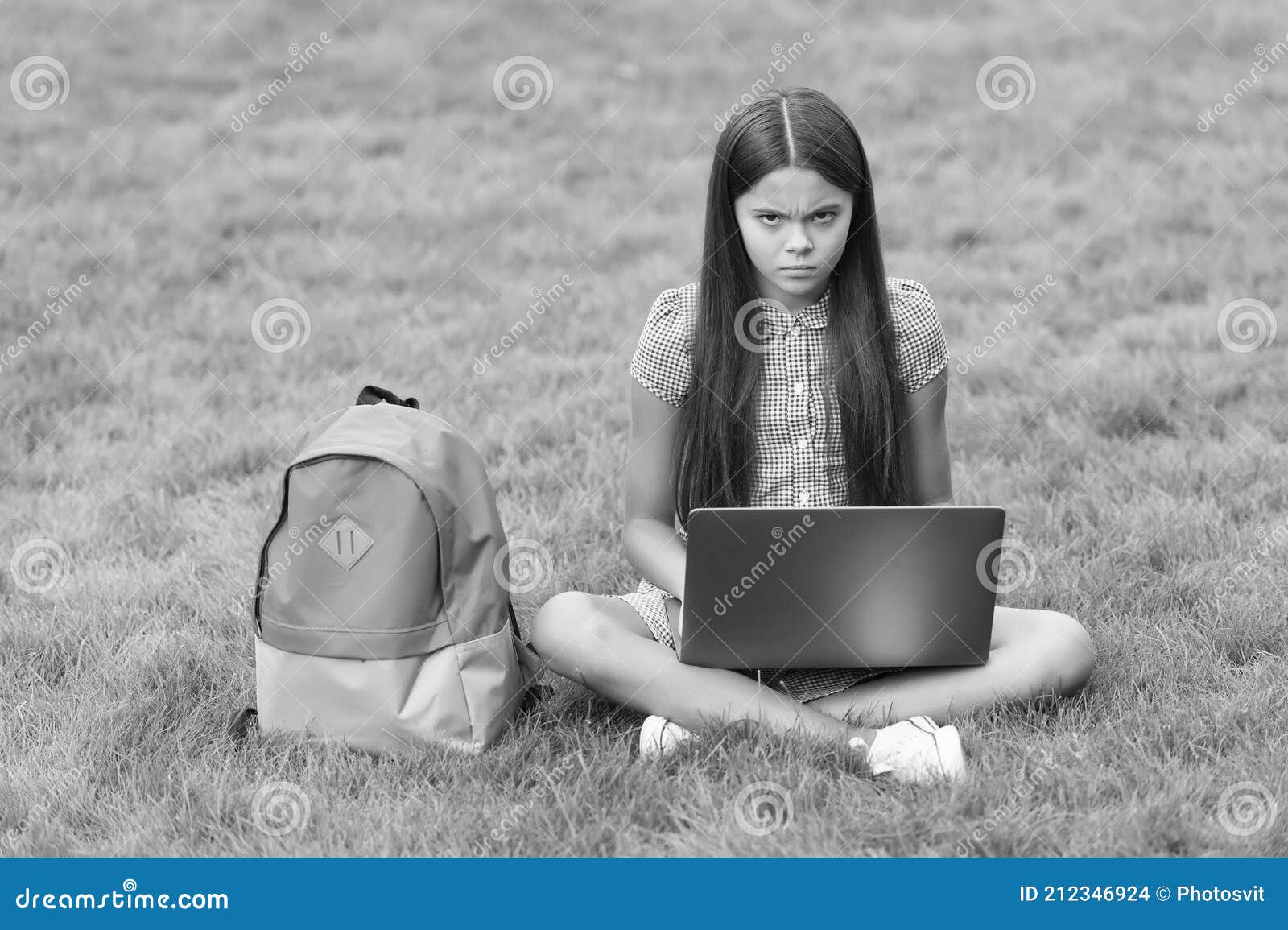 Upset Kid while Using Computer Sit on Green Grass in Park with School ...