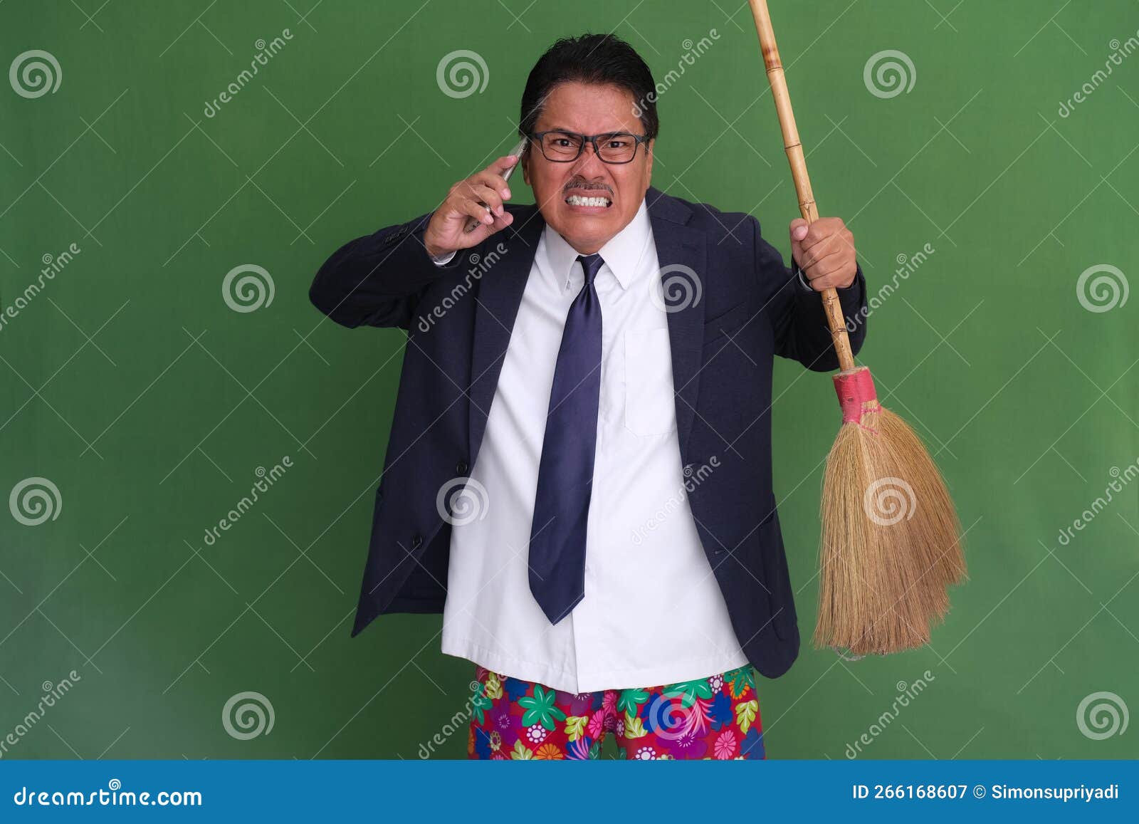 Upset Man Holding a Broom, Getting Ready for Work but Disturbed by a ...