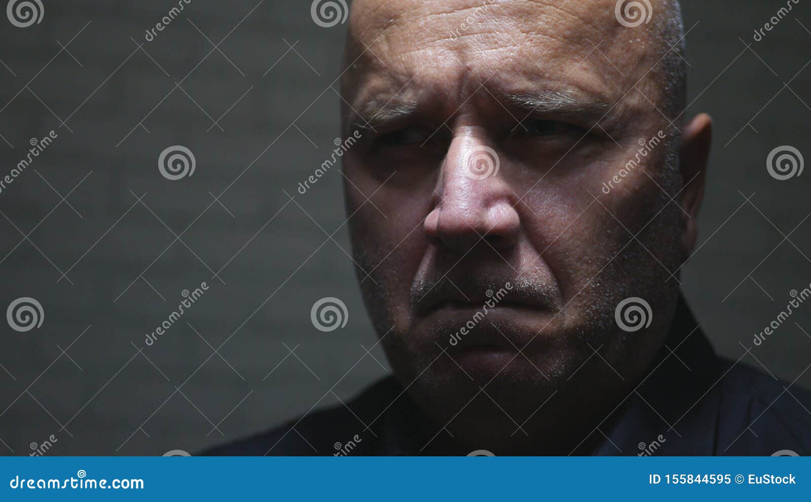 Upset Man Portrait in a Dark Place with a Nervous Face Expression Stock ...