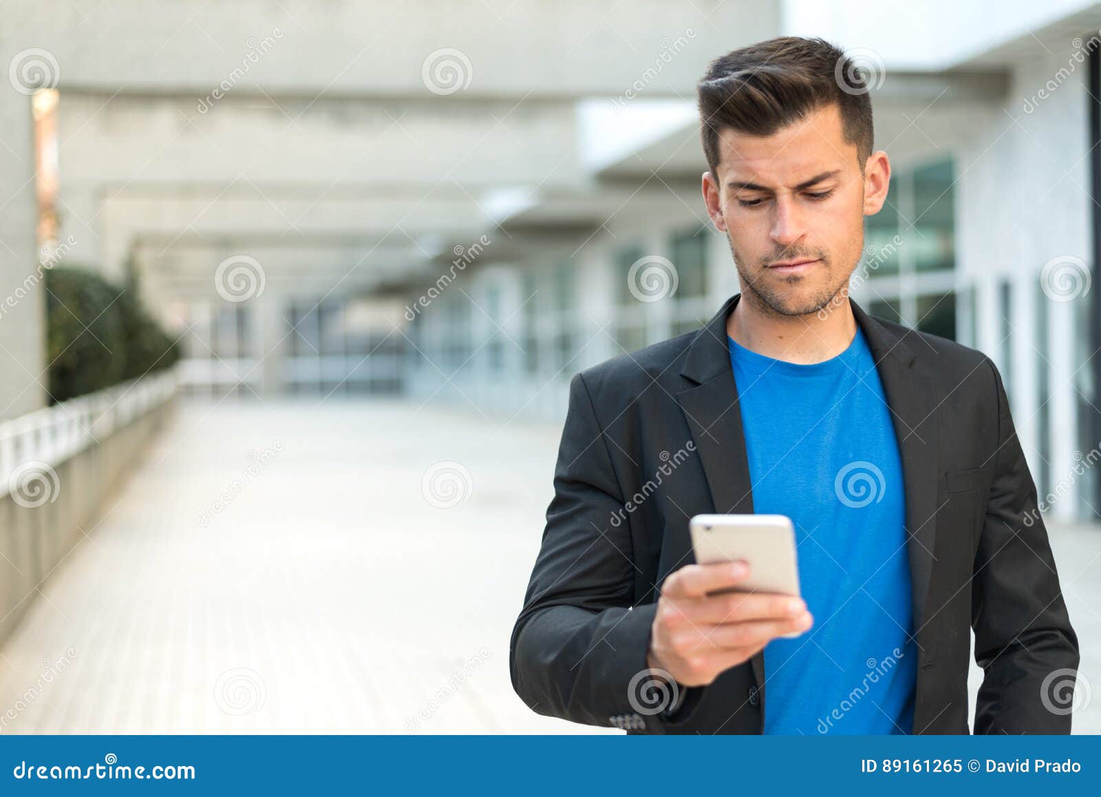 Upset Man Texting on Mobile Phone Stock Image - Image of close, model ...