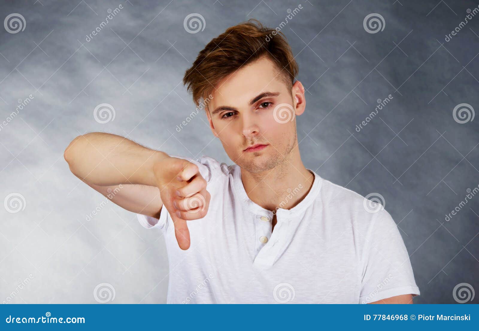 Upset Man with Thumbs Down. Stock Photo - Image of tshirt, portrait ...