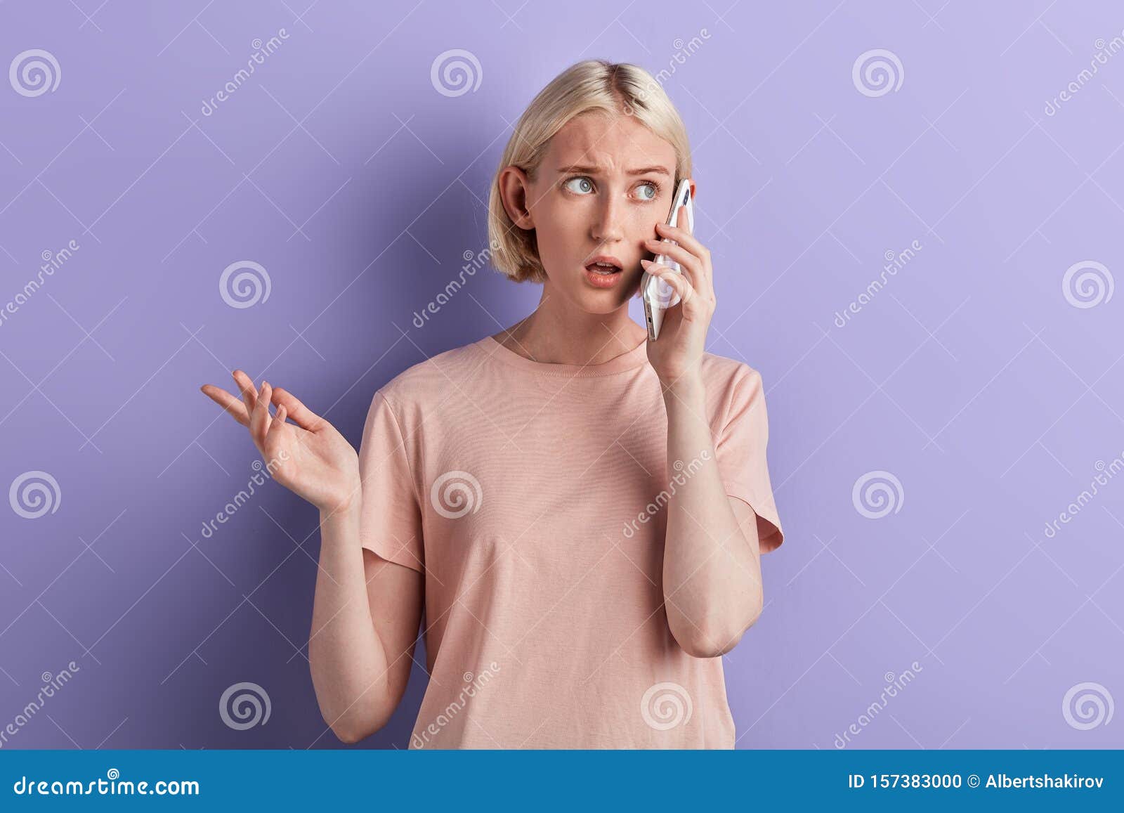 Upset Sad Skeptical Woman Talking On Cell Phone Violet Background