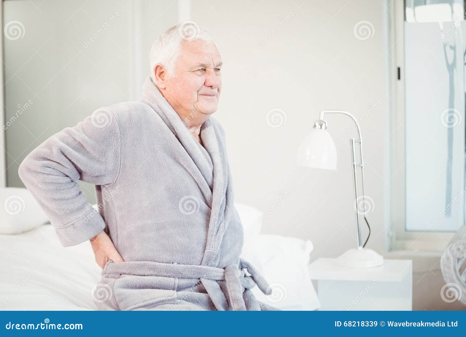 Upset Senior Man Sitting with Back Pain on Bed Stock Image - Image of ...