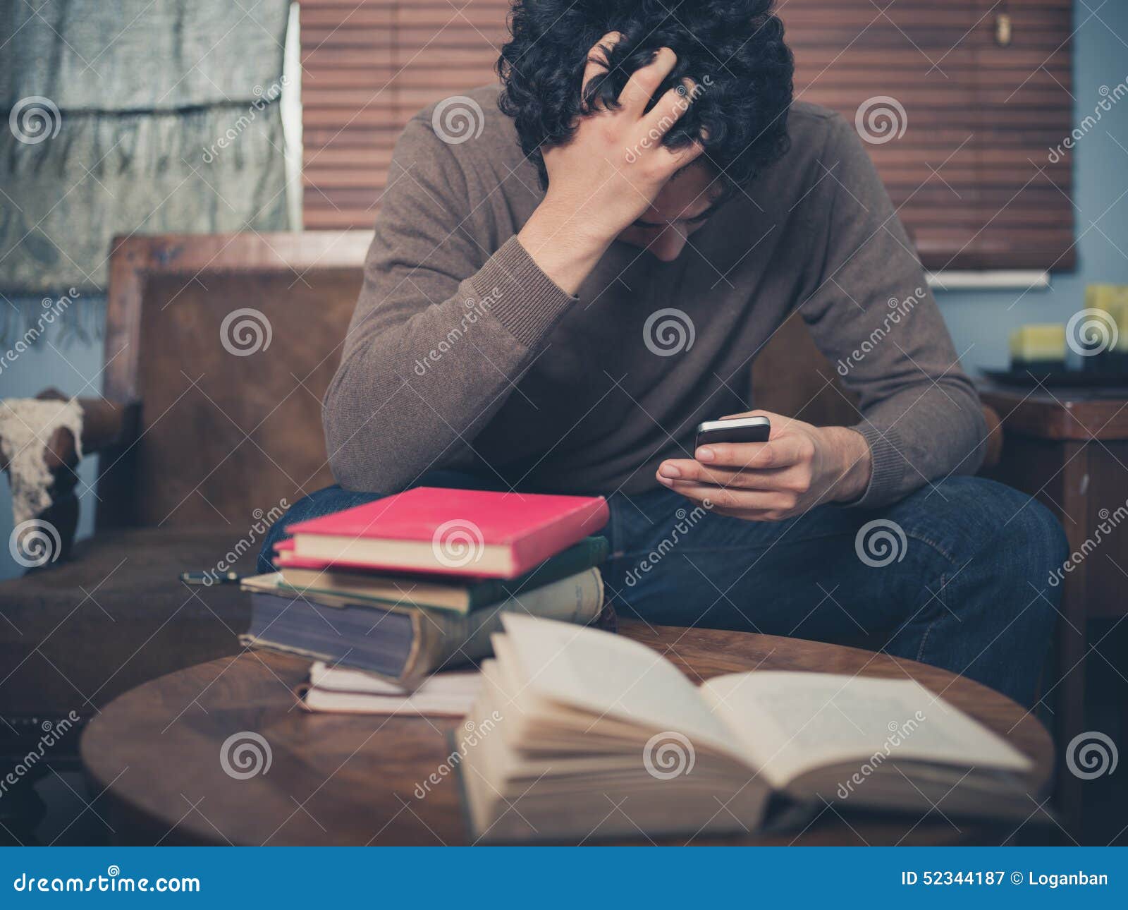 Upset Student Using His Smartphone Stock Image - Image of homework ...