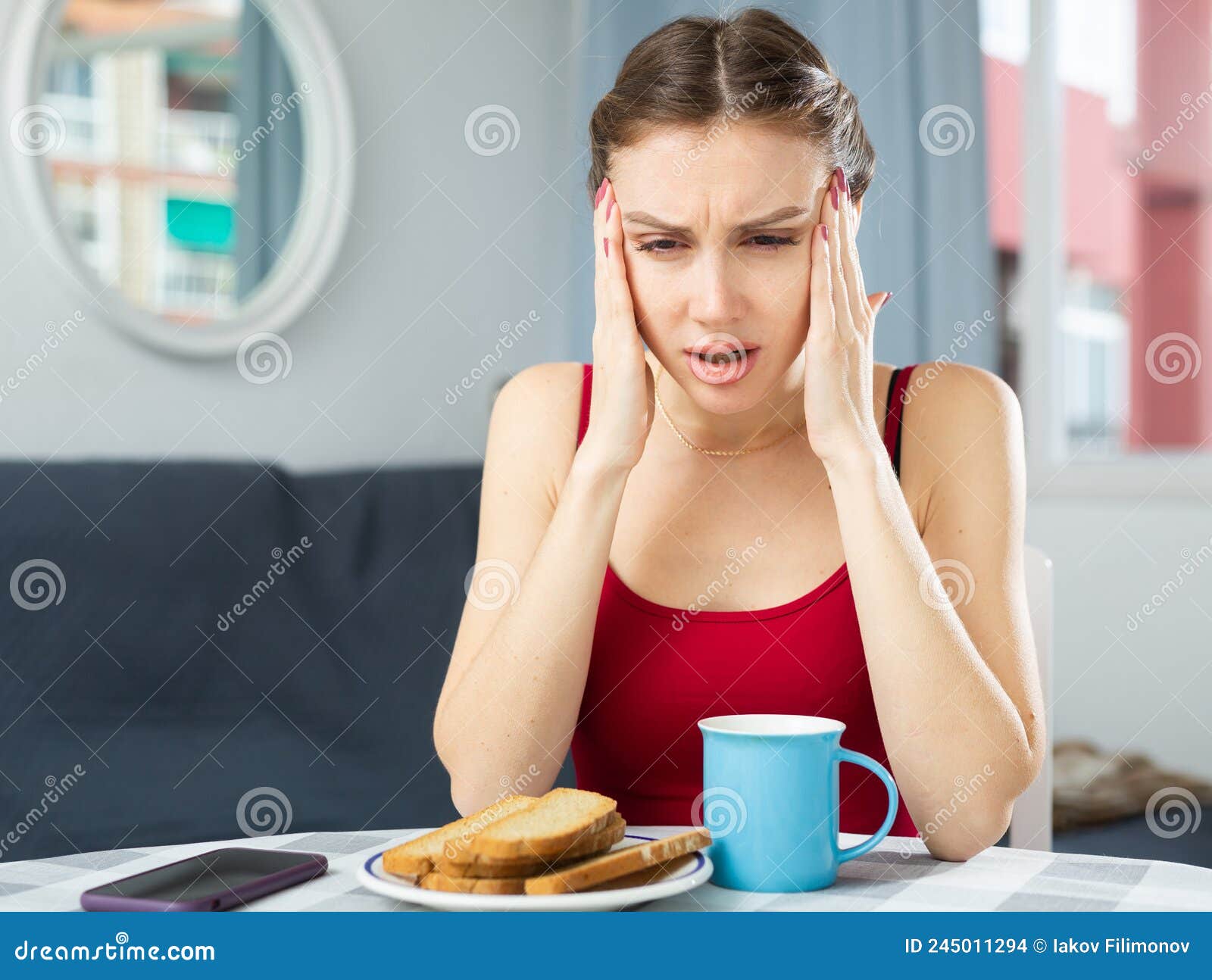 Upset Woman Crying while Sitting at the Table in Room Stock Photo ...
