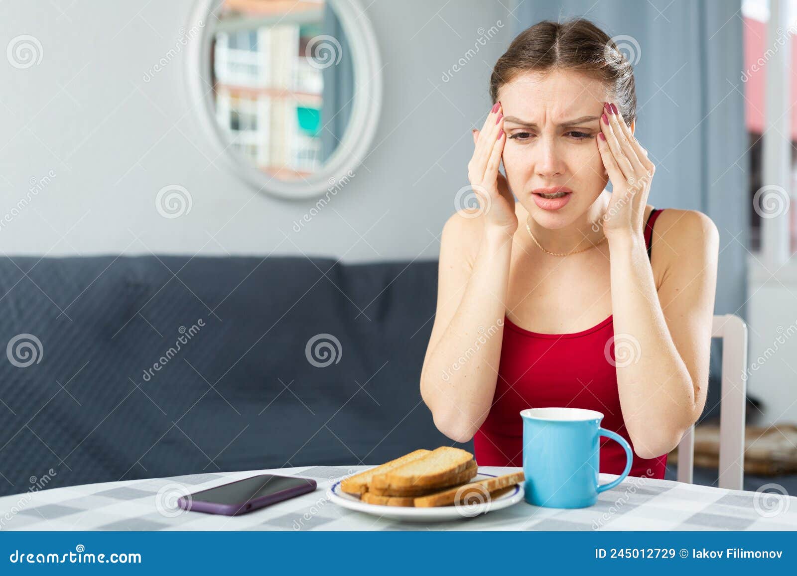 Upset Woman Crying while Sitting at the Table in Room Stock Image ...