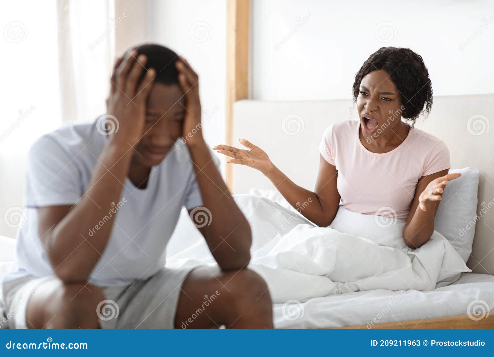 Upset Young African American Couple Having Fight Bedroom Interior