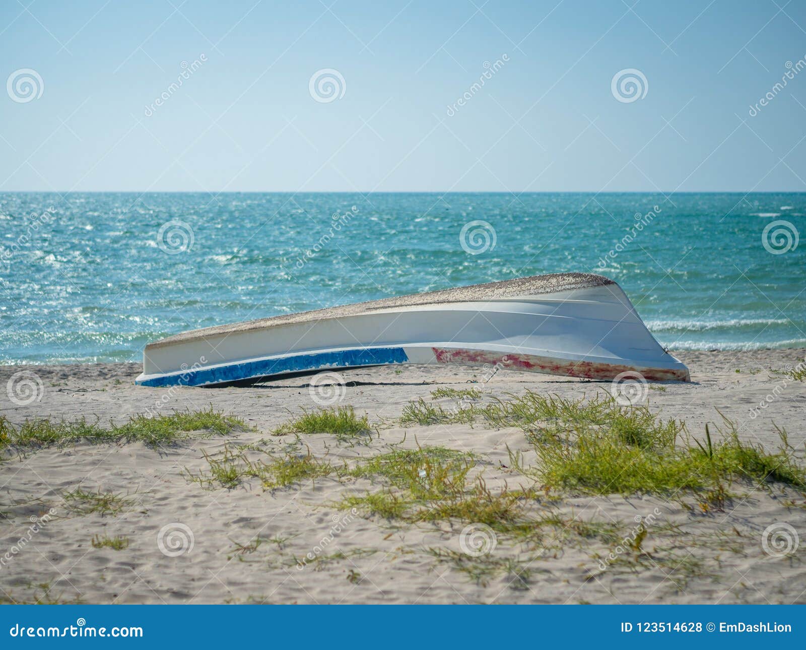 Upside Down Boat Resting on the Beach in Front of the Ocean Stock Photo ...