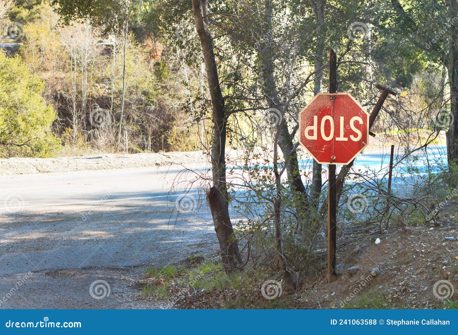Upside Down Stop Sign Near Highway Stock Photo - Image of sign, nature ...