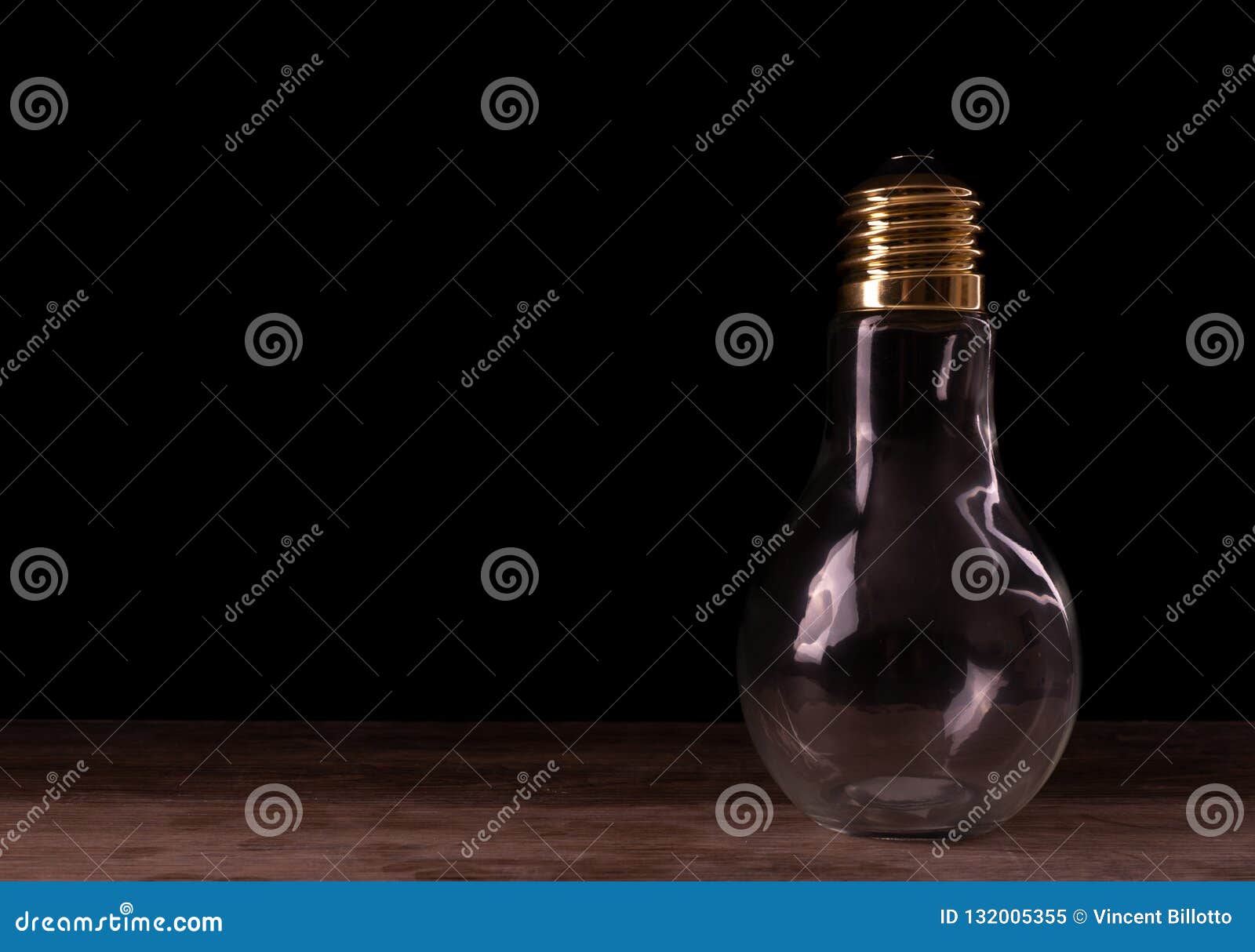 Upside Down View of a Glass Light Bulb on a Wooden Table Stock Image ...